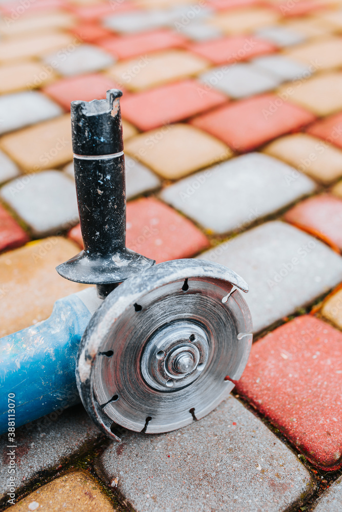 Diamond disc on a grinder for stone cutting - professional laying of ...