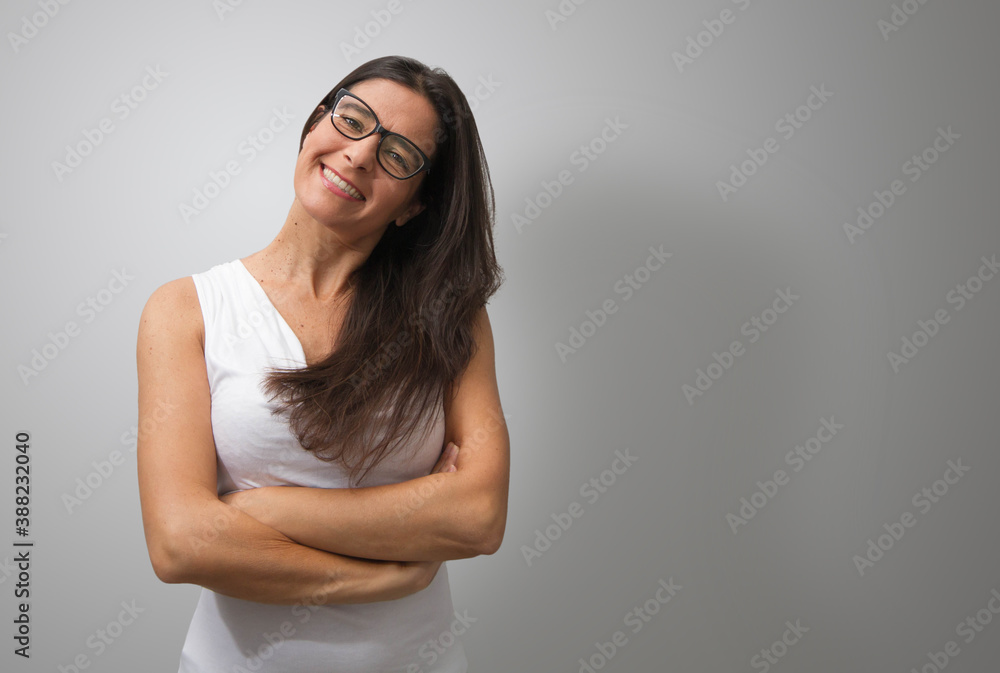 Attractive middle-aged Spanish woman, brunette with glasses, posing for ...