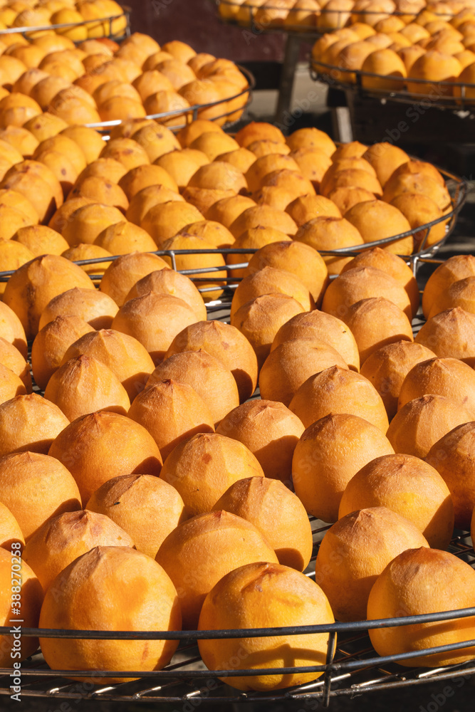 Foto de Making process of sun exposuring dried persimmon in a sieve in ...