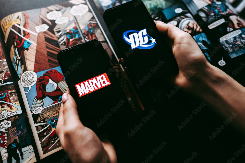 Marvel and DC logo on the comic book page background. Rostov-on-Don ...