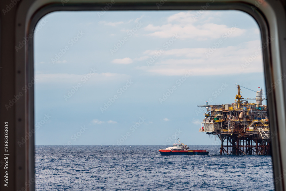 Offshore production platform viewed from an anchor handling tug boat ...