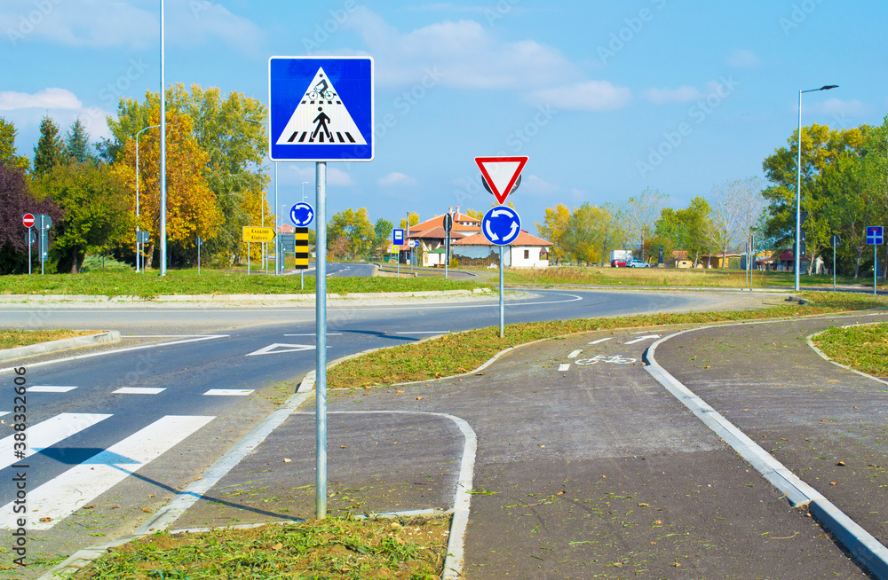 Road signs that shows crosswalk and cycle path crossing ahead of ...