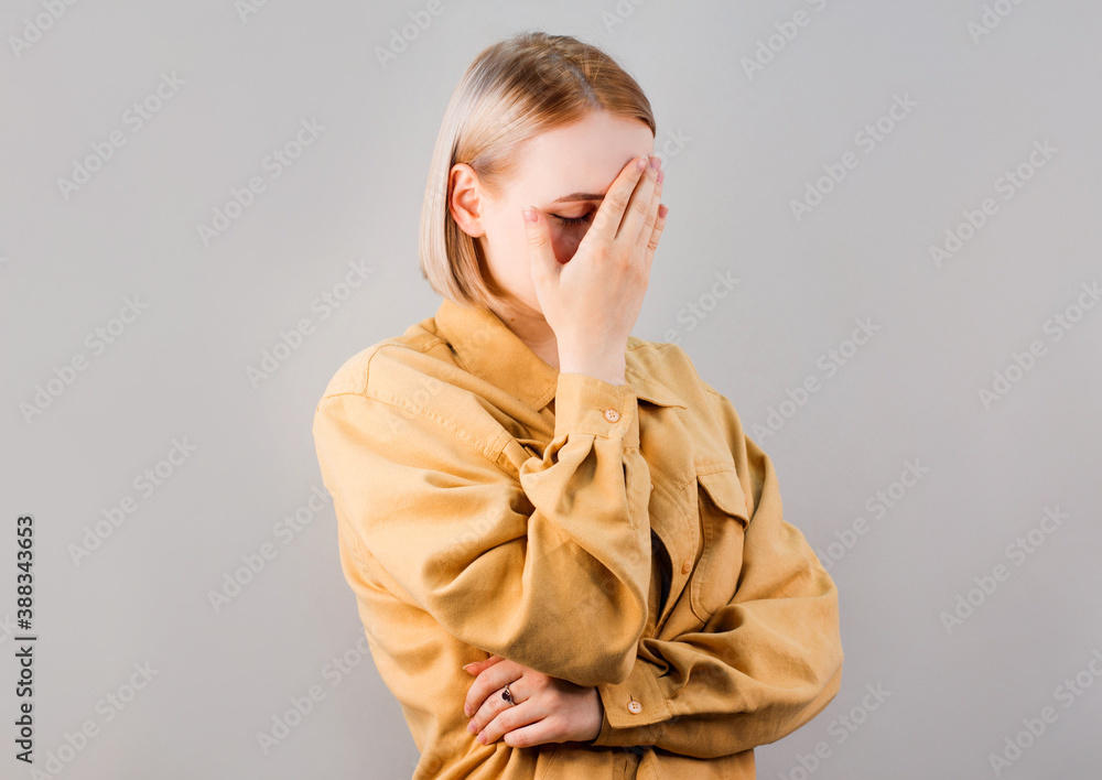 Embarrassed annoyed adult woman hiding face bend head down, facepalm ...