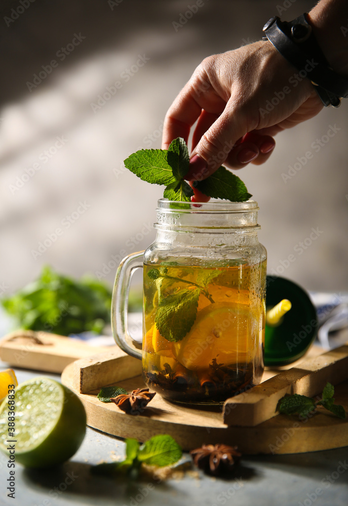 Hot moroccan tea with hand. Drink with lemon, lime, orange, mint ...