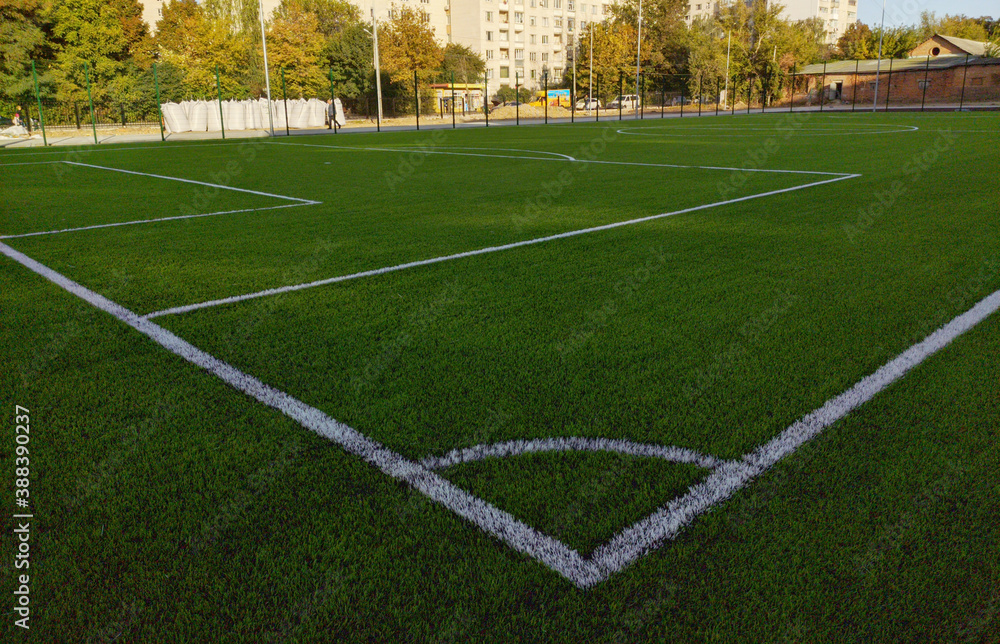 Artificial grass soccer field. Corner kick line of ball and a soccer ...
