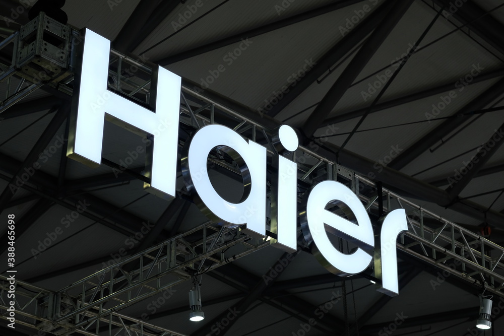 Shanghai/China-June 2019: white shiny brand logo of Haier Corporation ...