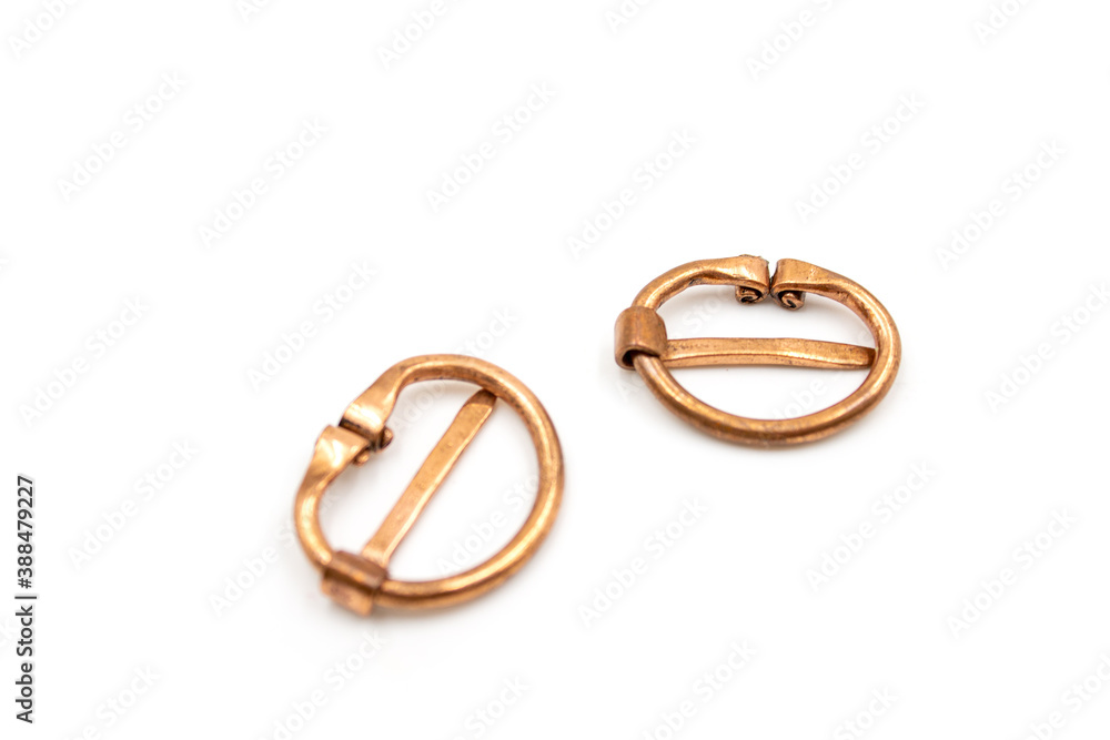 Isolated photos of a medieval copper fibula Stock Photo | Adobe Stock