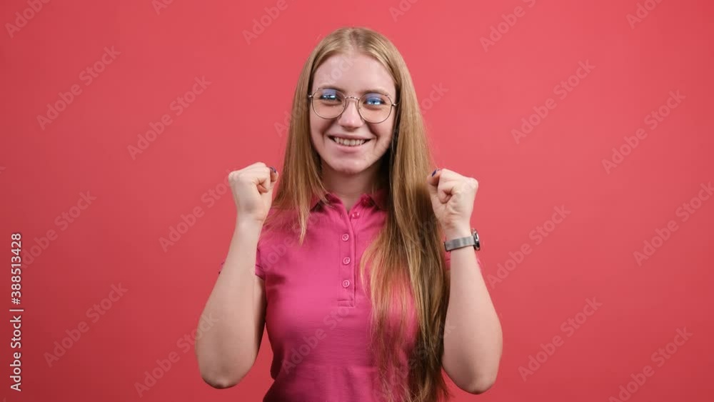 Yes, I done it. Excited cheerful female model with joyful expression ...