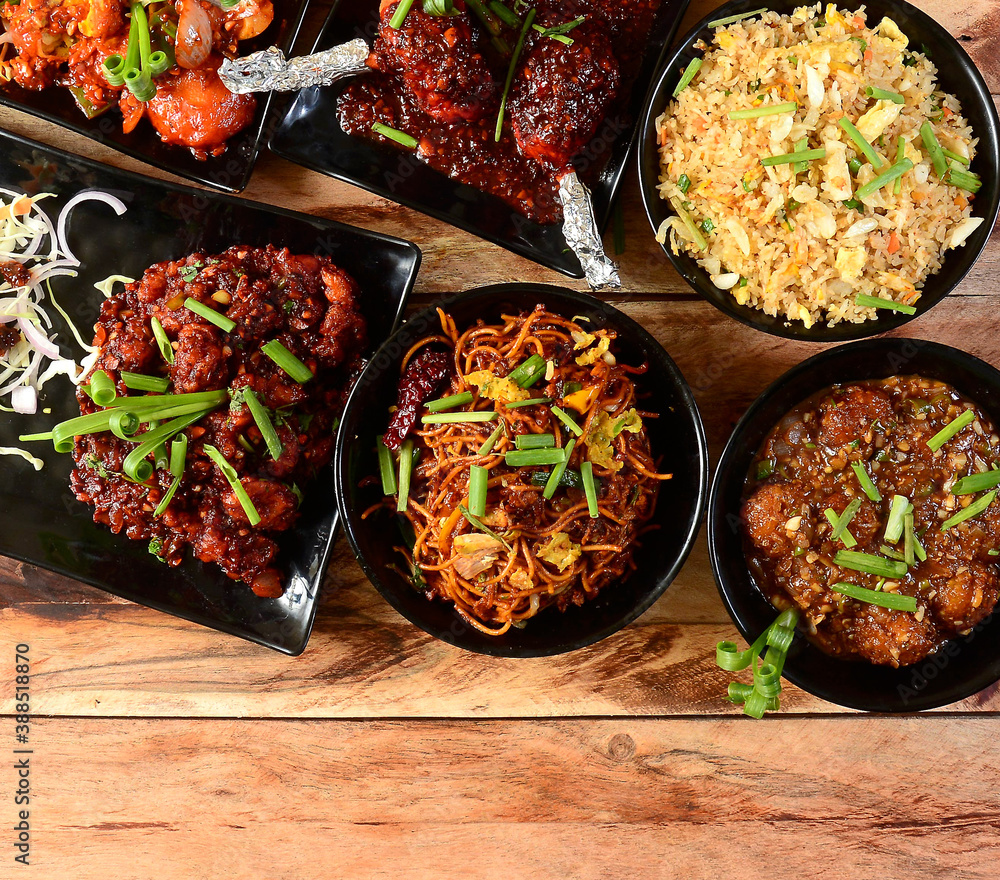 Assorted indian food on wooden background. Egg fried rice,chicken ...