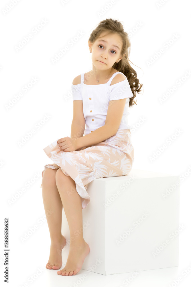 Portrait of Thoughtful Beautiful Girl Sitting on White Cube Stock Photo ... Portrait of Thoughtful Beautiful Girl Sitting on White Cube Stock Photo ...