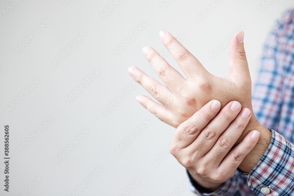 Health care concept. man suffering from pain weakness and tingling in ...