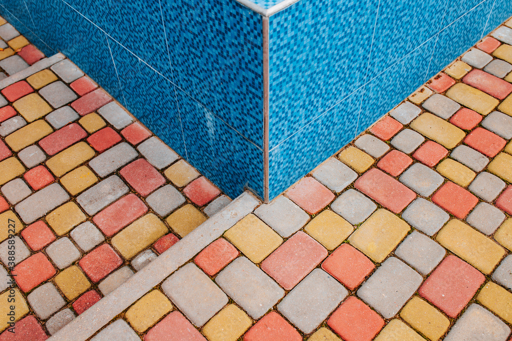 Multi-colored paving slabs on the ground in the courtyard of a private ...
