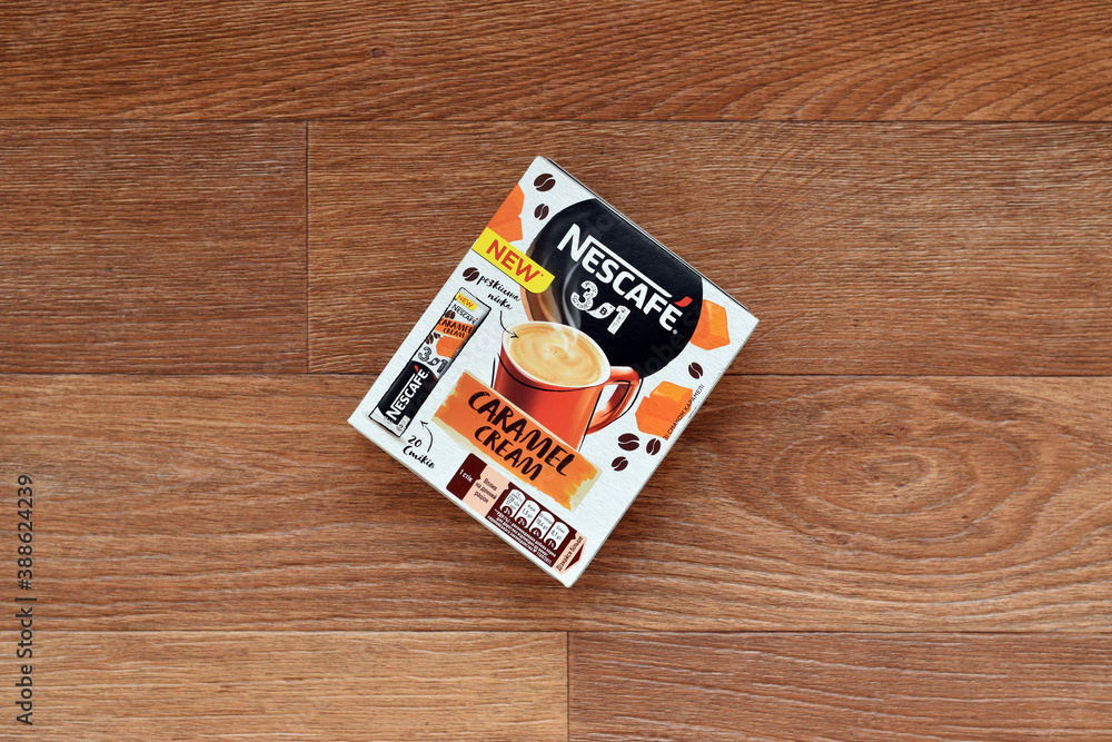 Nescafe caramel cream coffee sticks box on wooden background. Nescafe ...