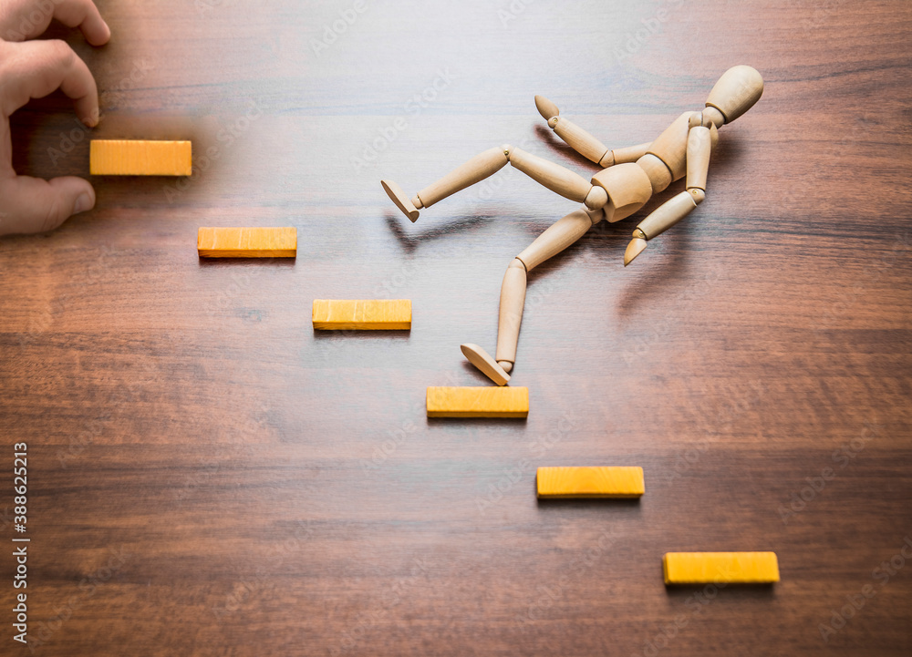 wooden figure man falling down from stairs, accident, concept, failure ...