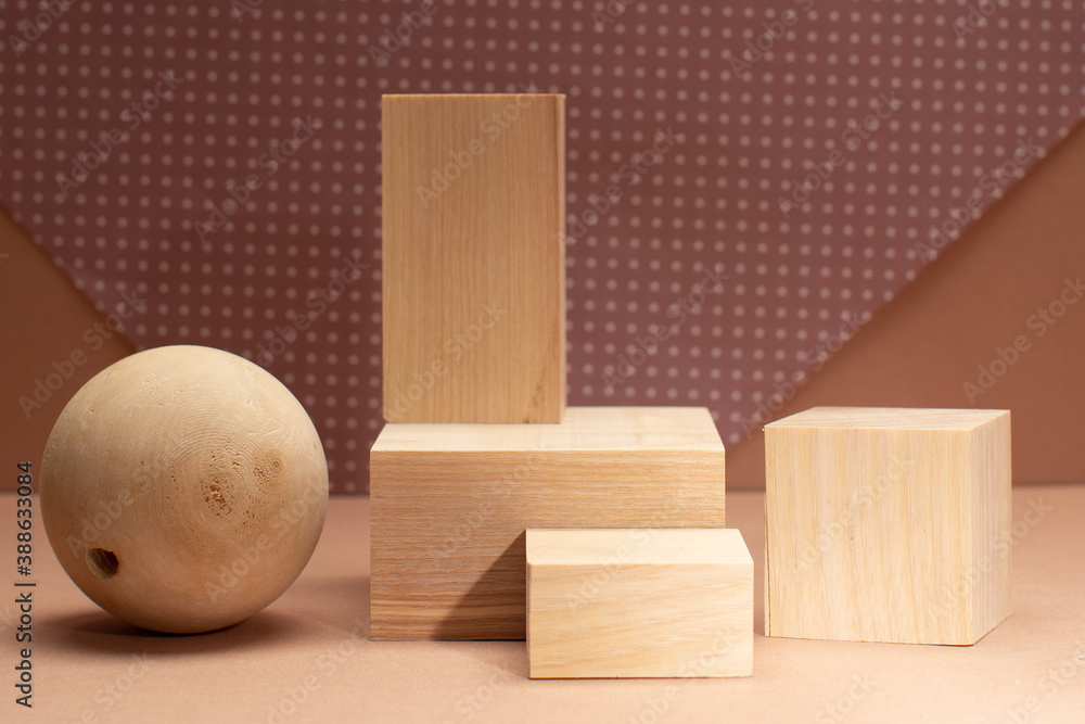 Conceptual Background with light wooden podiums and wooden ball on ...
