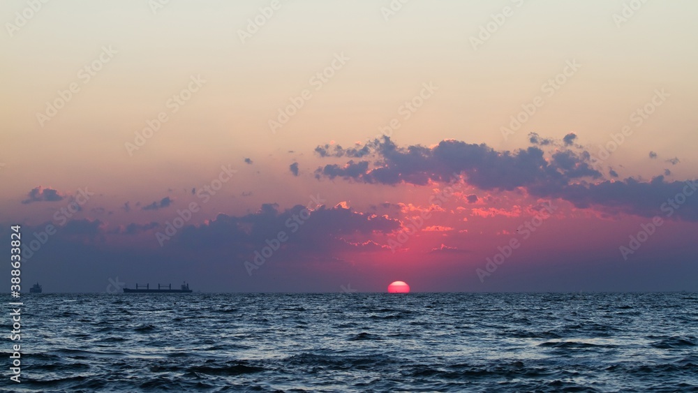 sundawn on the Black Sea near Odesa, sun disk appear on horizon with ...