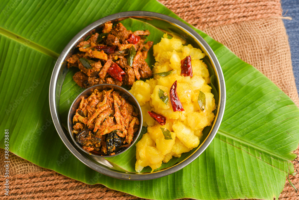 Cooked tapioca with spicy fish curry , Cassava root , Mandioca , Aipim ...