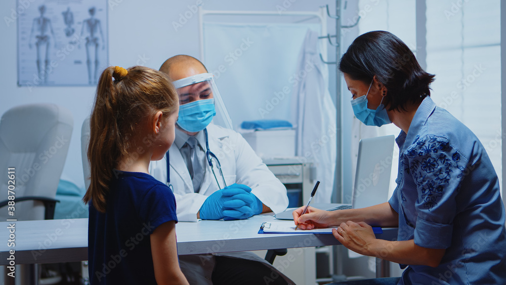 Woman writing prescription on clipboard listening doctor instructions ...