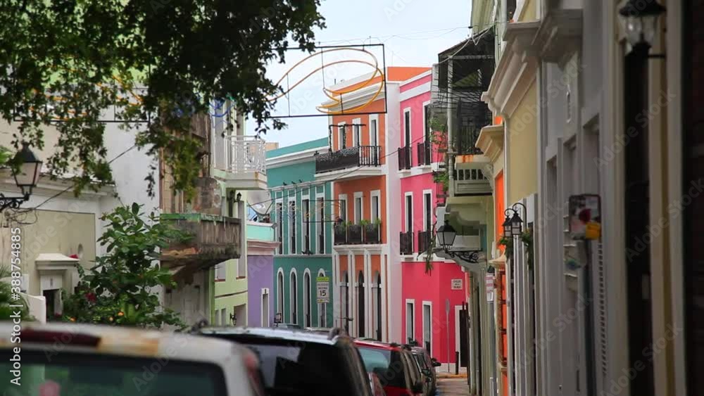 A short pan shot of urban Puerto Rico with vibrant colored buildings ...