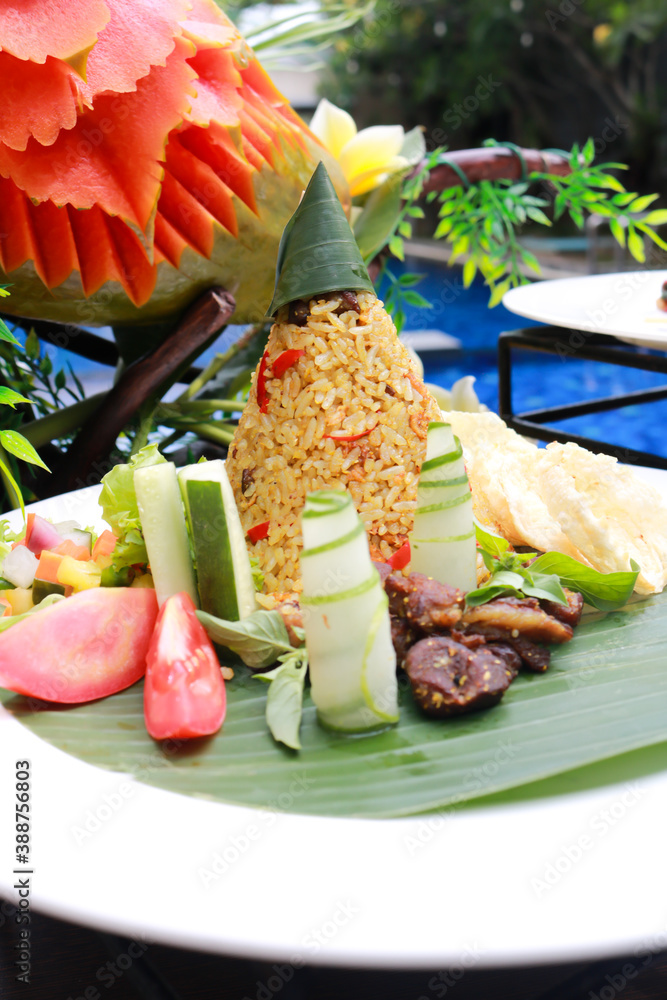 Traditional Indonesian Cuisine Nasi Tumpeng. Tumpeng is a cone-shaped ...