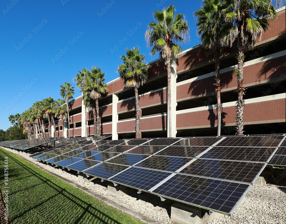 Solar panels installed in front of a parking garage converting the sun ...