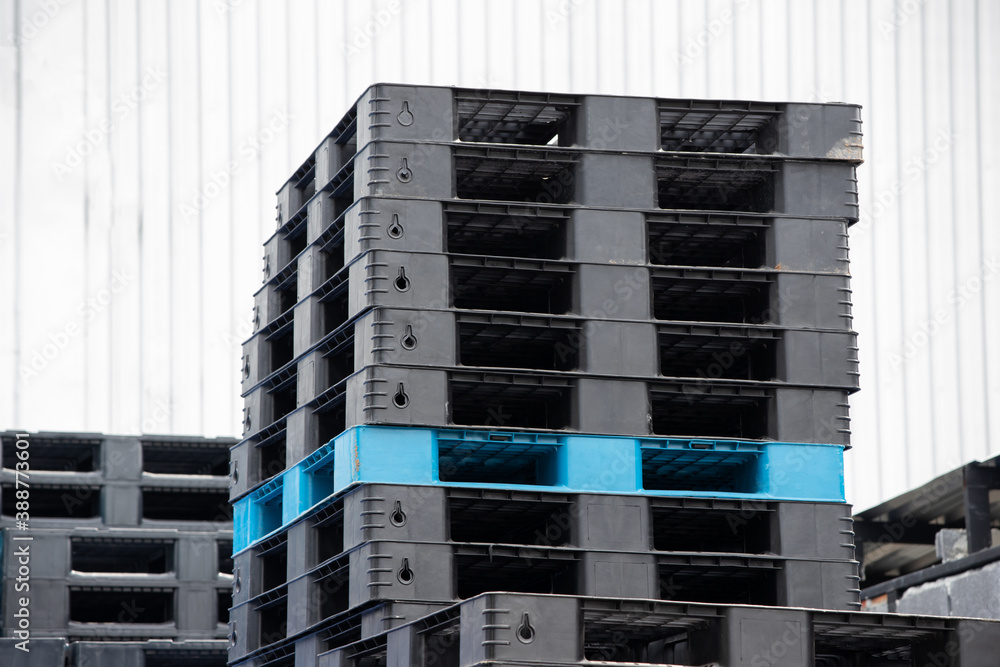 black industry plastic pallets in factory yard background. Stock Photo ...