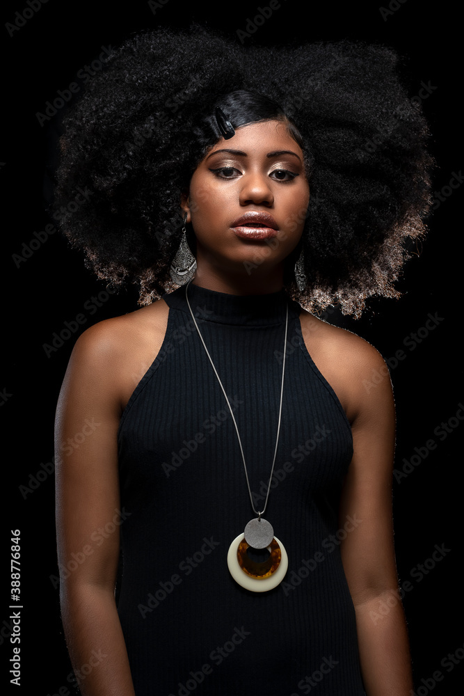 afro model, in black dress with big hair afro style, young woman, low ...
