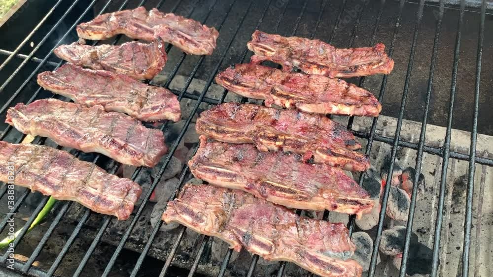 Korean BBQ ribs (also known as Galbi or Kalbi) cooking over a charcoal ...
