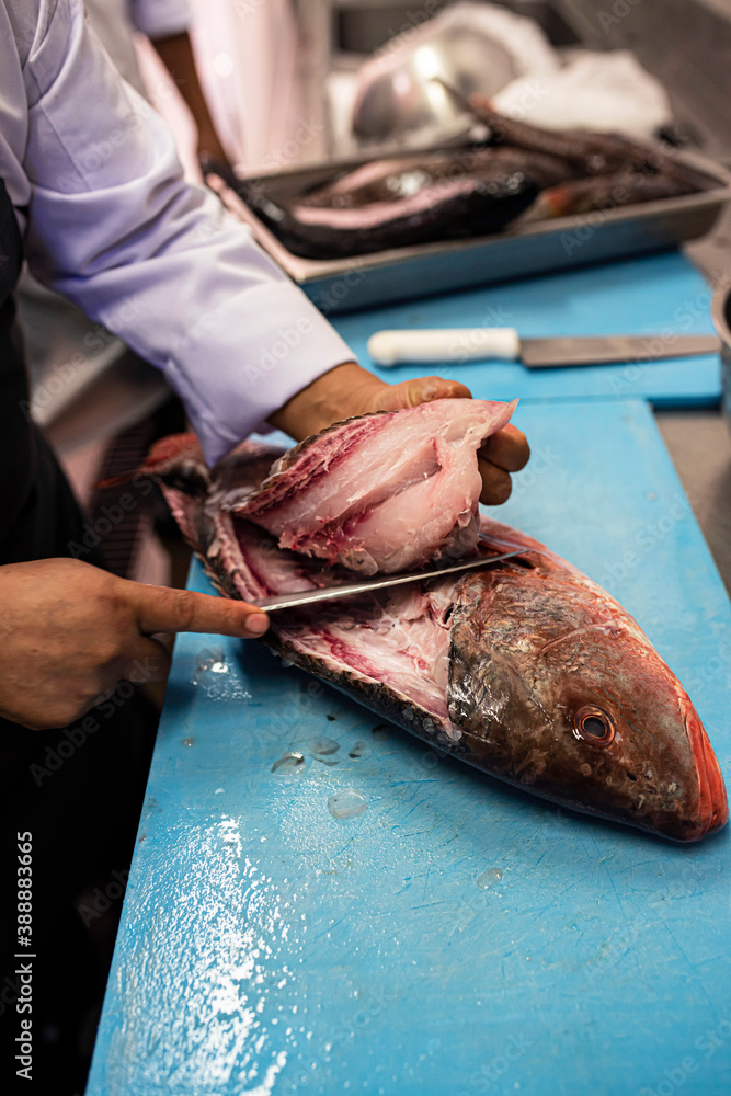 Cleaning fish Stock Photo | Adobe Stock