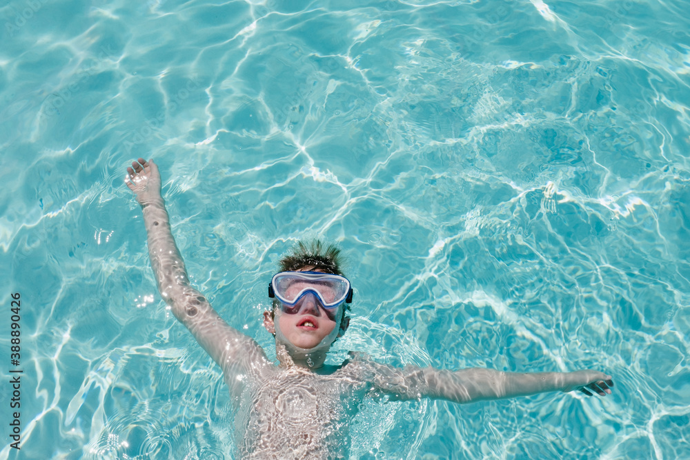 Child floating in a Pool Stock Photo | Adobe Stock