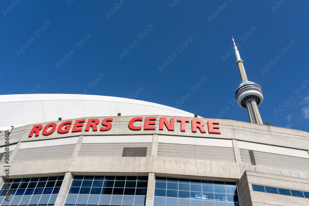 Toronto, Canada - October 28, 2020: Rogers Centre sign with CN Tower is ... Toronto, Canada - October 28, 2020: Rogers Centre sign with CN Tower is ...
