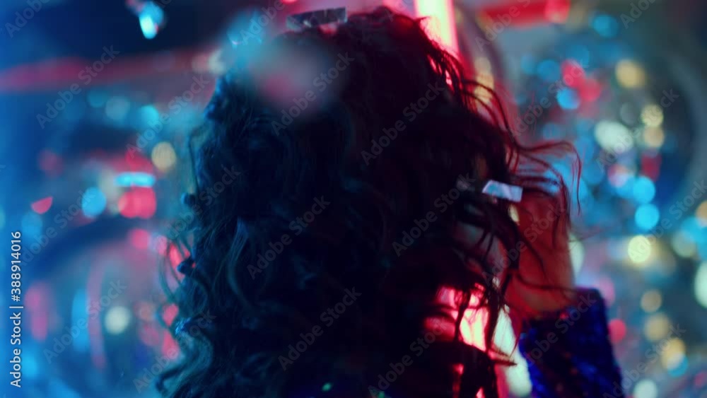 Charming girl biting lip at party. Pretty female person flirting in ...