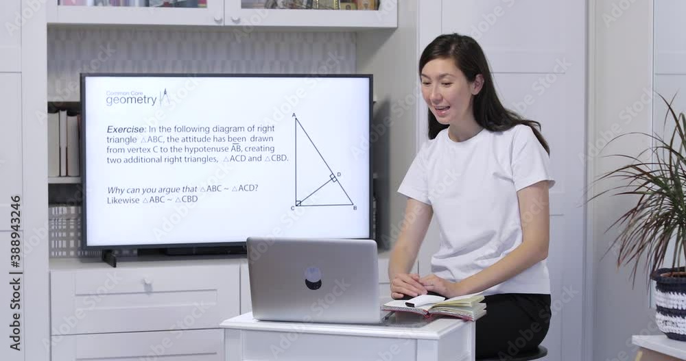 Female teacher gives common core geometry online lesson via internet ...