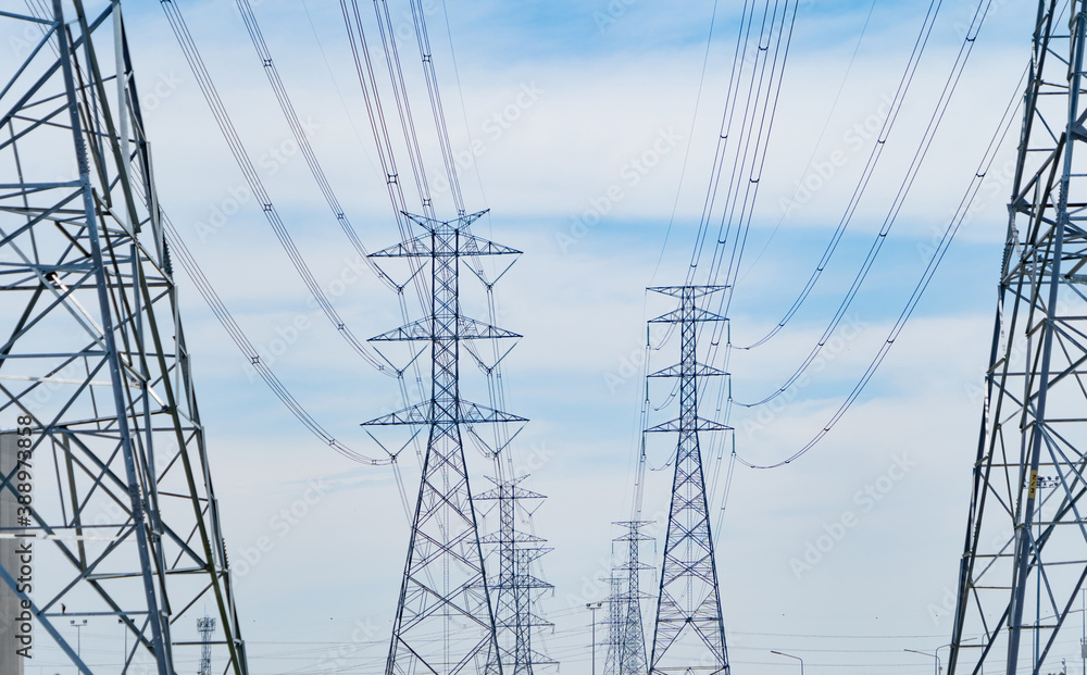 High voltage poles. Power lines on utility tower and cable wires in ...