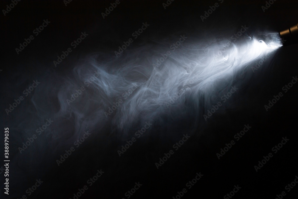 spotlight, ray of light on smoke. black backround Stock Photo | Adobe Stock