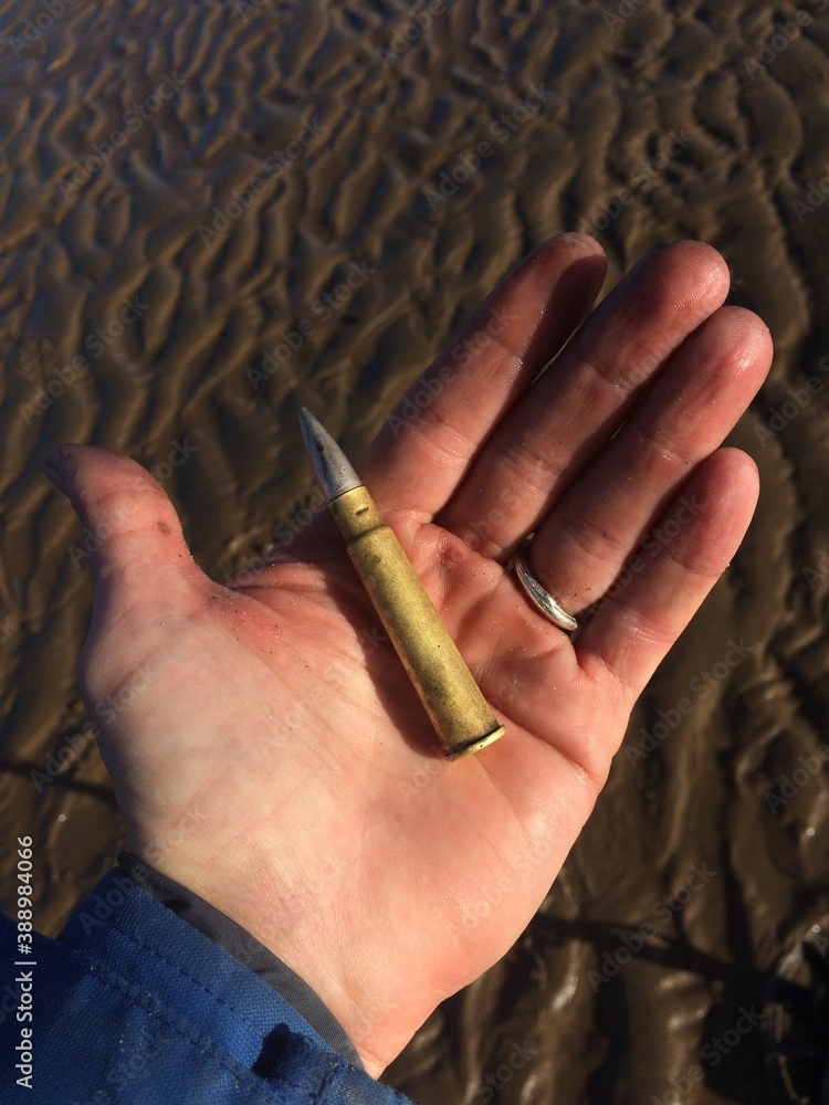 A live 1941 world war 2 machine gun bullet found on a beach in england ...