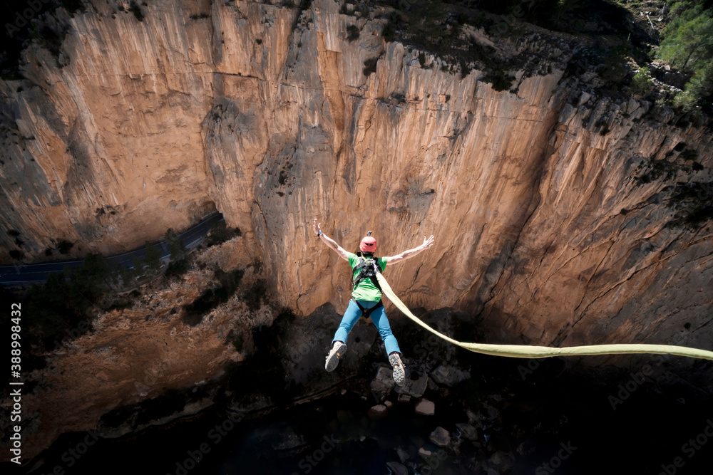 bungee jumping in the mountain with nature plants and rocks co road and ...