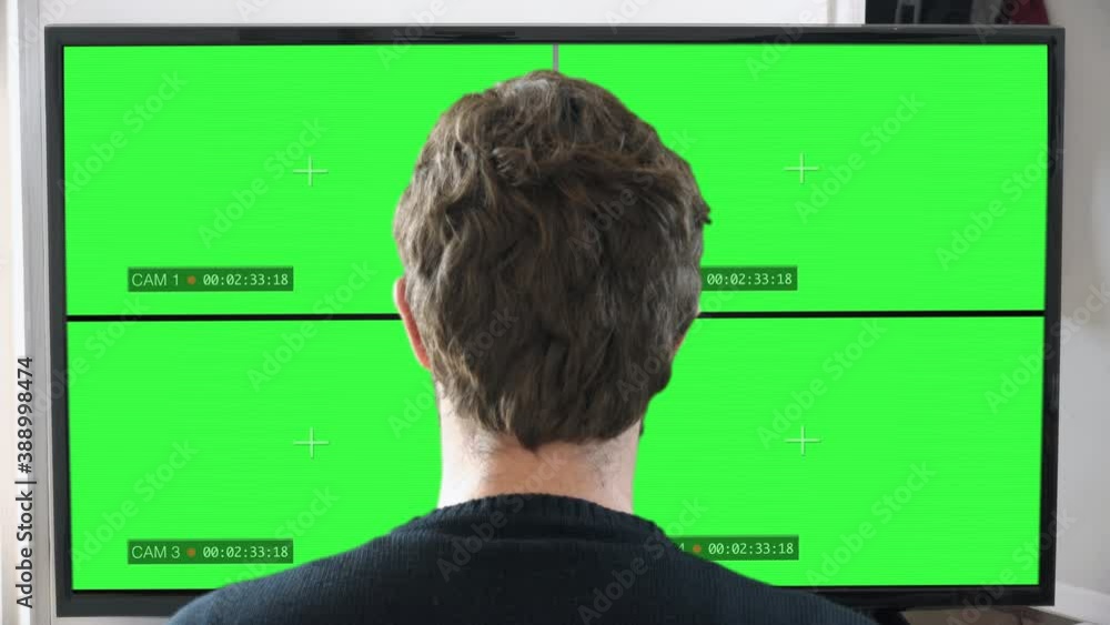 Watching Home Security Cameras Green Screen Split Screen. Headshot of a ...