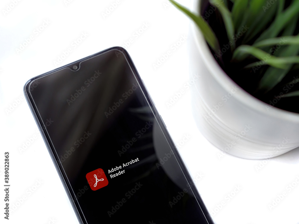 Modern minimalist office workspace with black mobile smartphone with ...