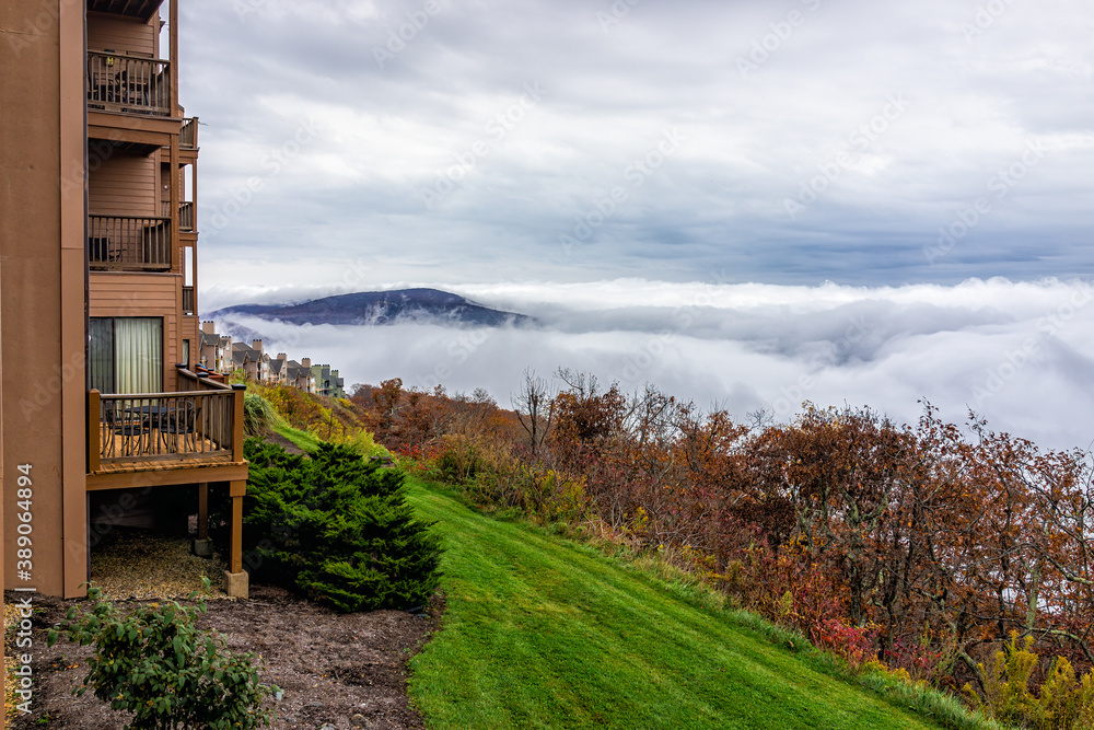 Wintergreen, Virginia green grass and autumn fall foliage trees by ...