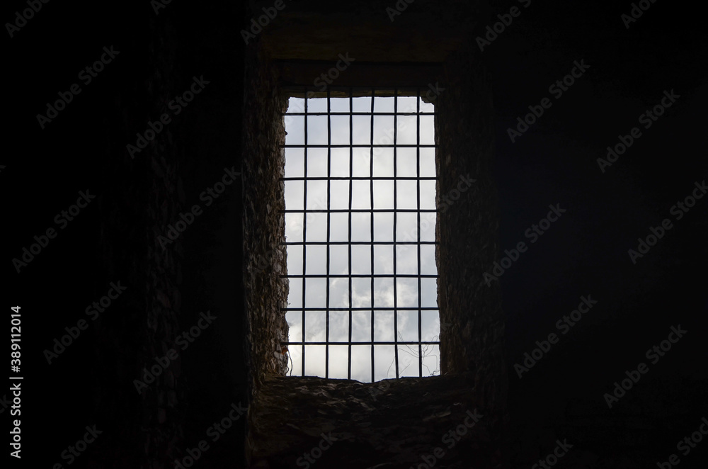 Metal bars in jail. Medieval prison with iron bars. Security grids in ...