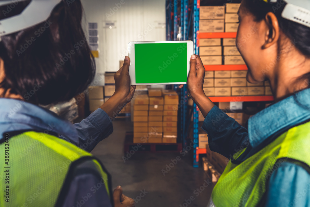 Computer with green screen display in warehouse storage room . Delivery ...