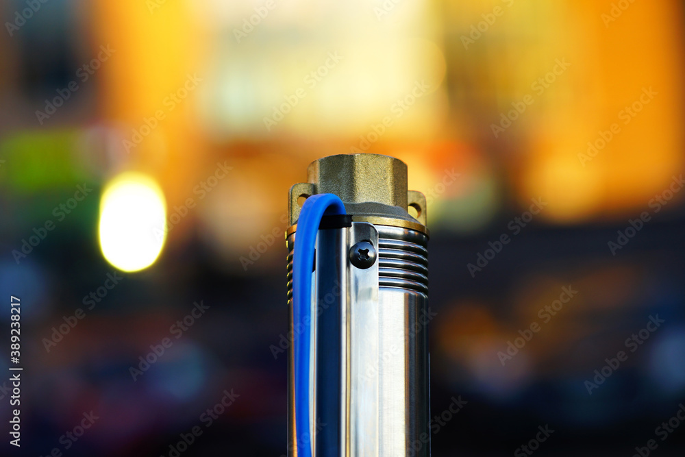 Well centrifugal pump on a bright background. Submersible pump for ...