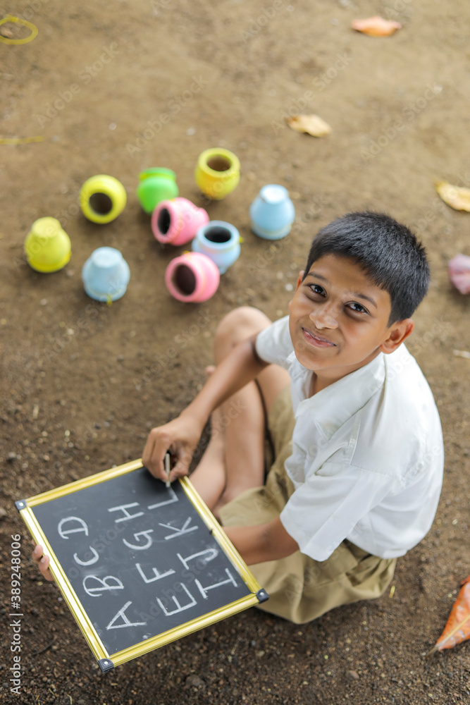 Indian child writing A B C D alphabet on Chalkboard Stock Photo | Adobe ...