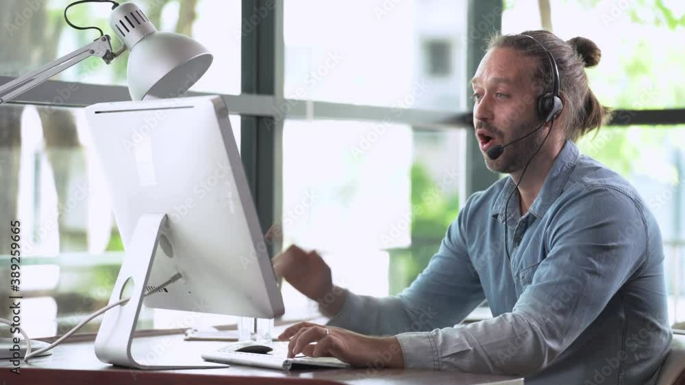 operator call center man working and looking to laptop. Relaxing Male ...