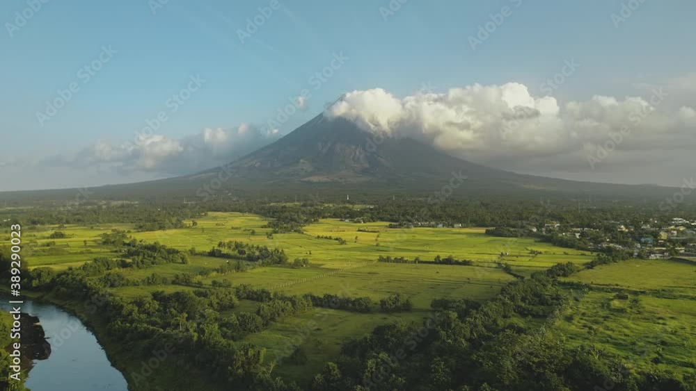 Tropic river with green banks at Mayon volcano eruption aerial ...