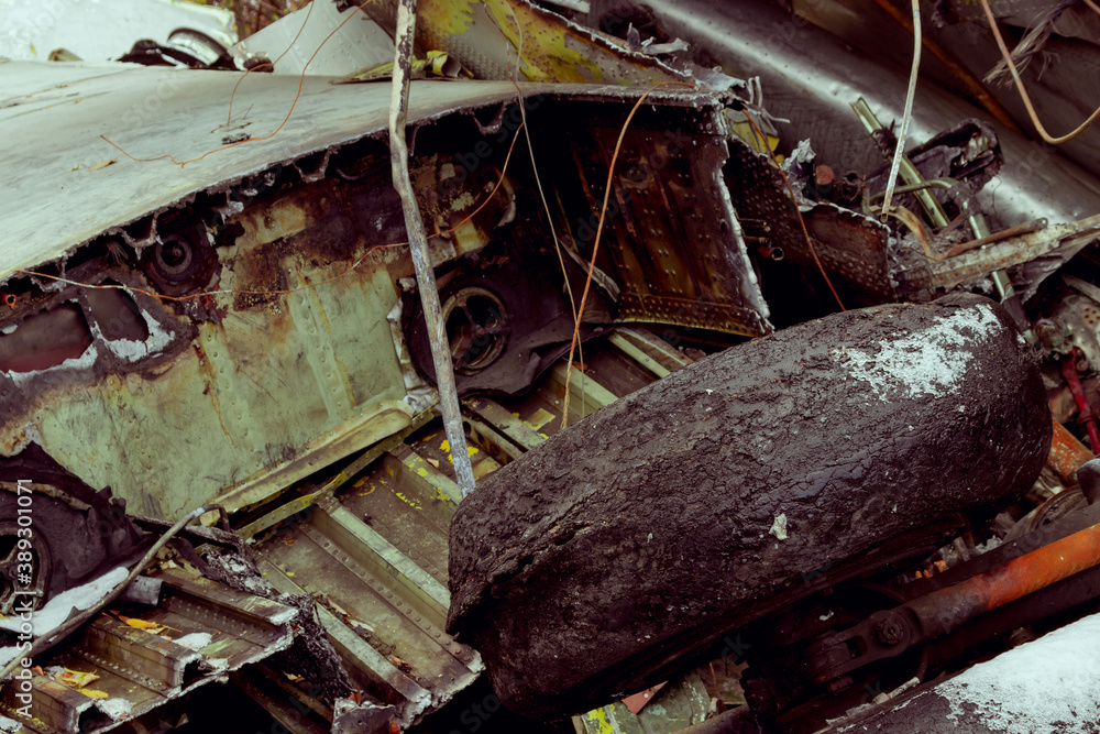 Plane wreckage, parts of the fuselage and wing of the burned and broken ...