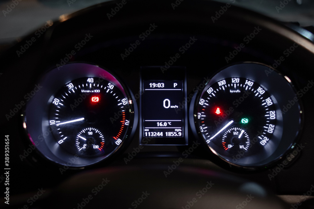 Inside the car, close-up of a circular dashboard, speedometer and ...