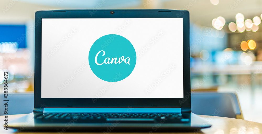 Laptop computer displaying logo of Canva Stock Photo | Adobe Stock