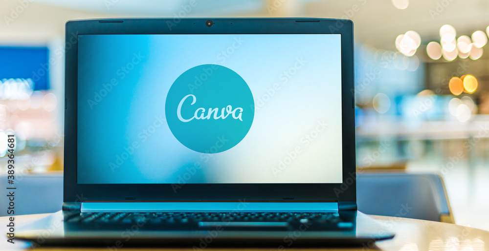 Laptop computer displaying logo of Canva Stock Photo | Adobe Stock